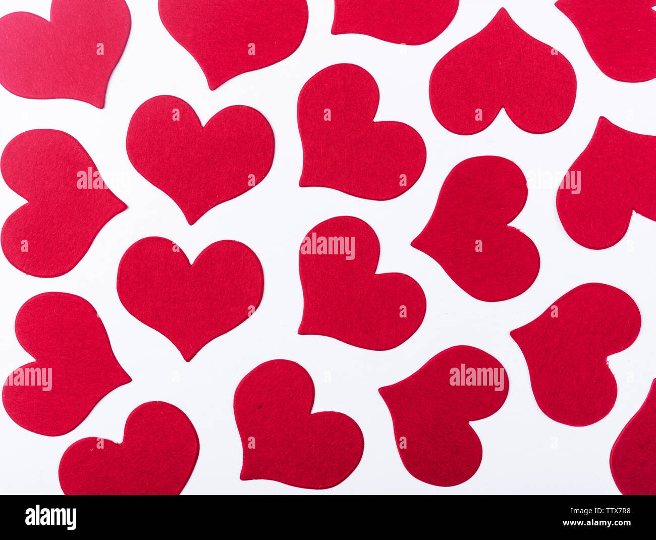 Repeated red love heart shape on white background Stock Photo - Alamy