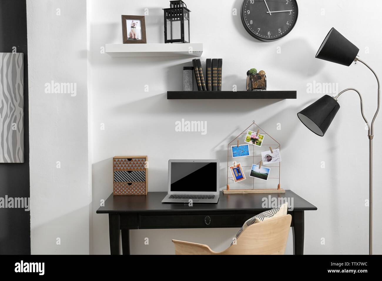 Workplace with laptop on table in modern room Stock Photo - Alamy