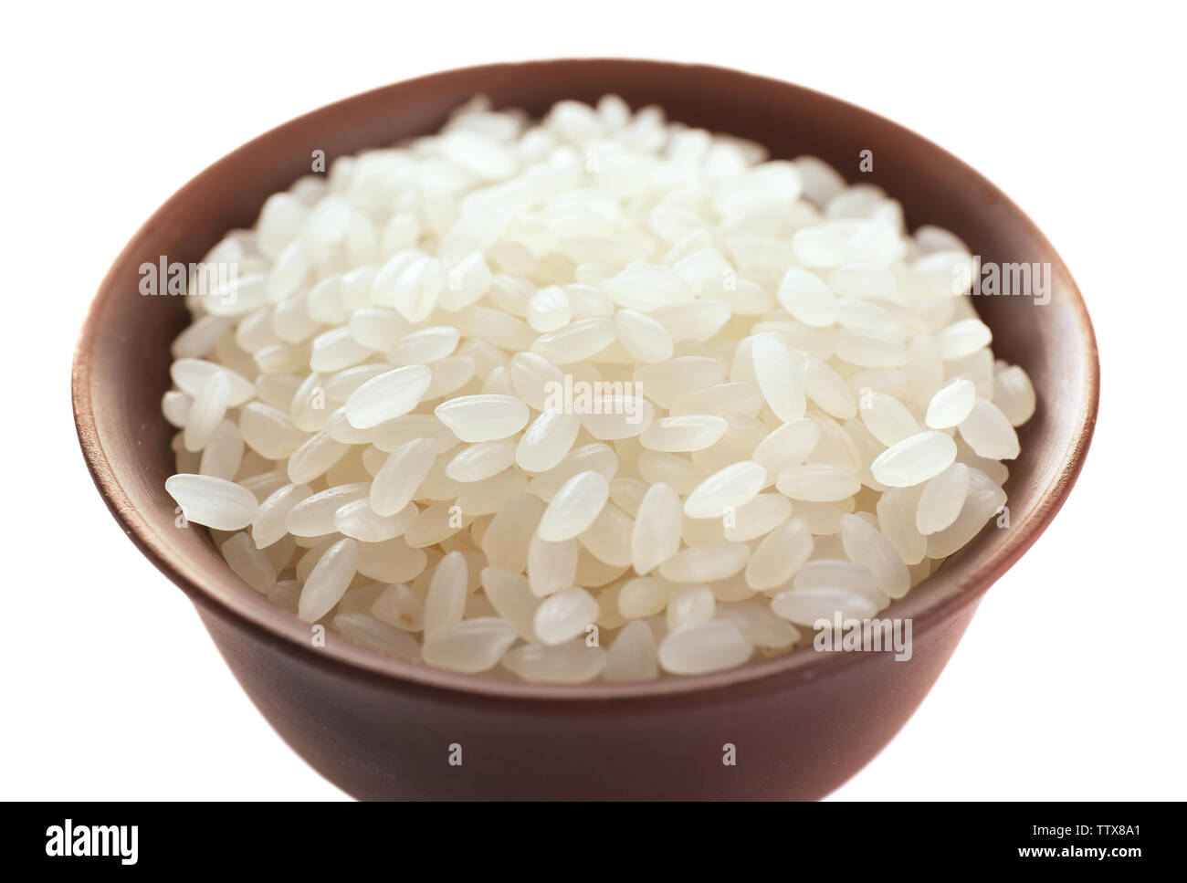 White rice in cup closeup Stock Photo - Alamy