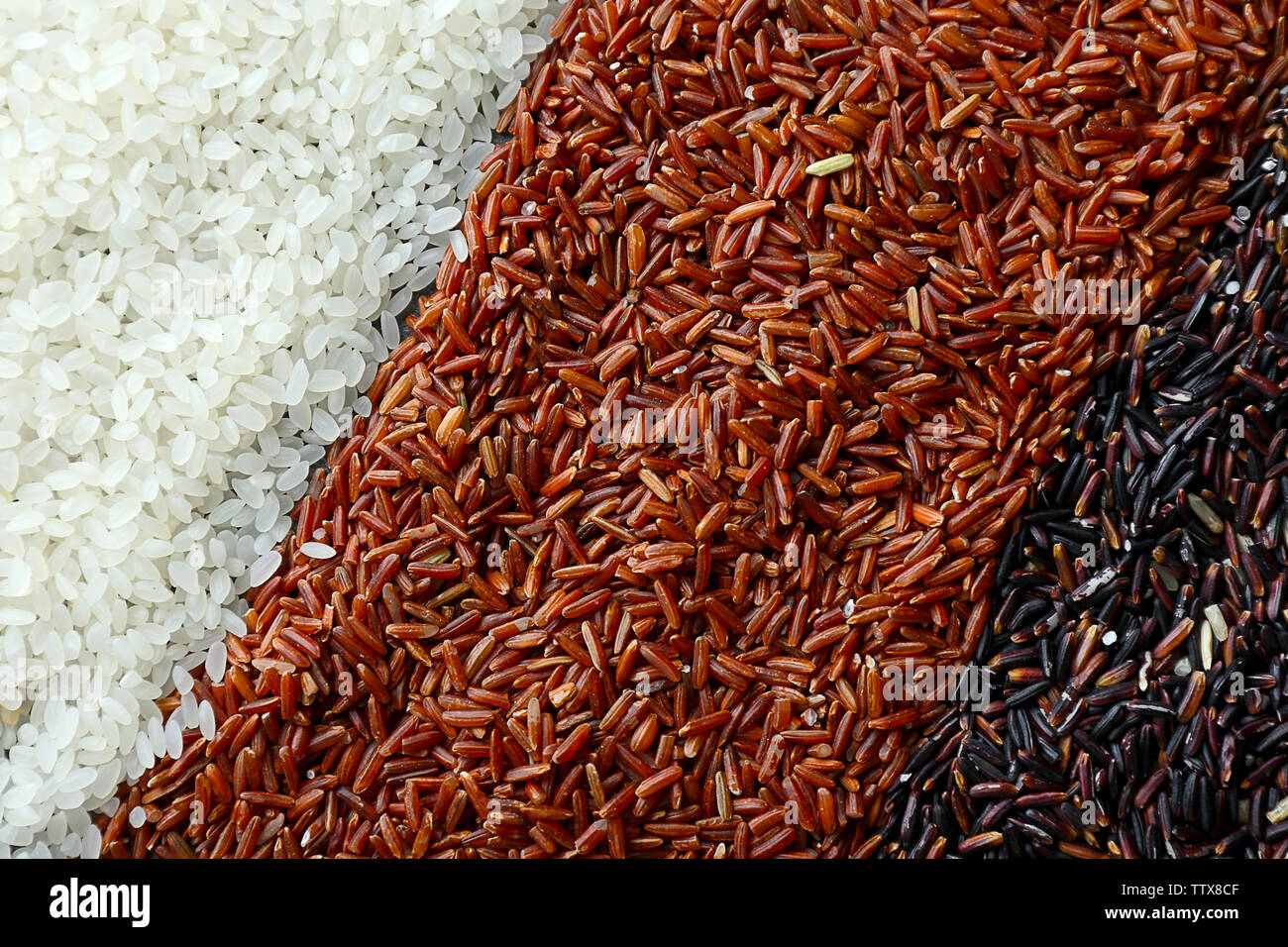 Different types of rice as background Stock Photo - Alamy