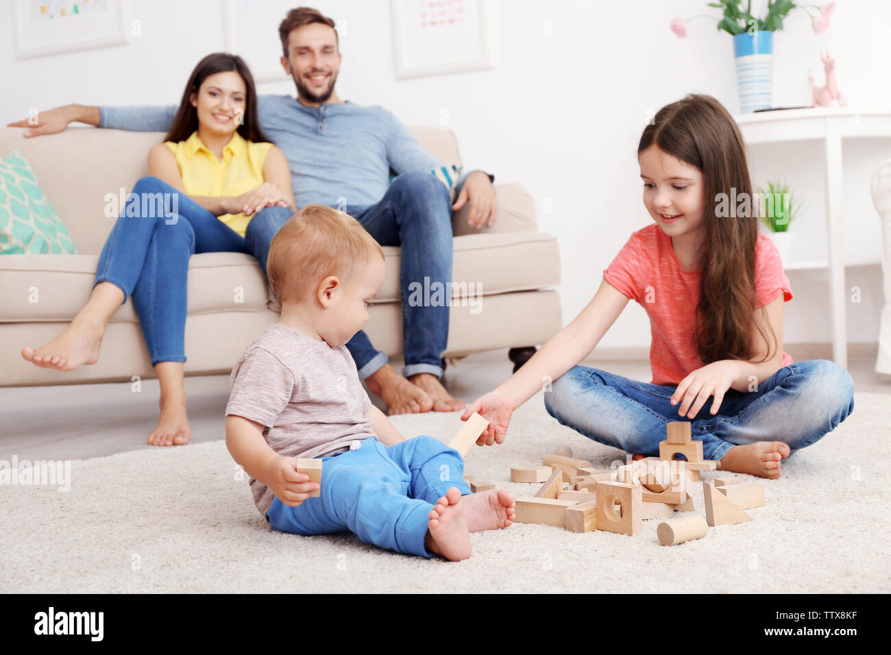 Cute kids playing games at home Stock Photo - Alamy