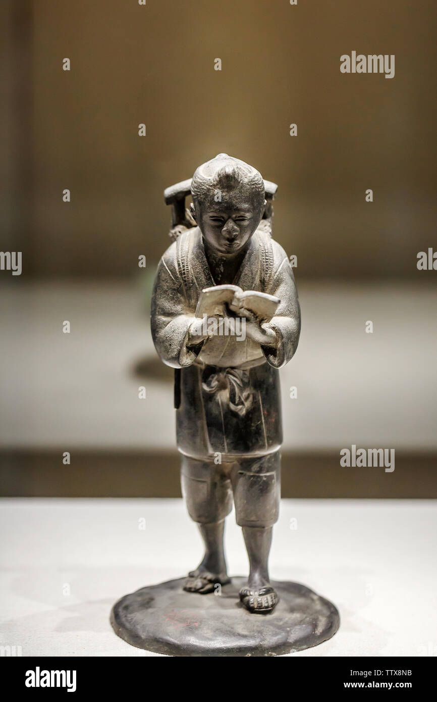 Bronze statue of ancient scholar Stock Photo - Alamy