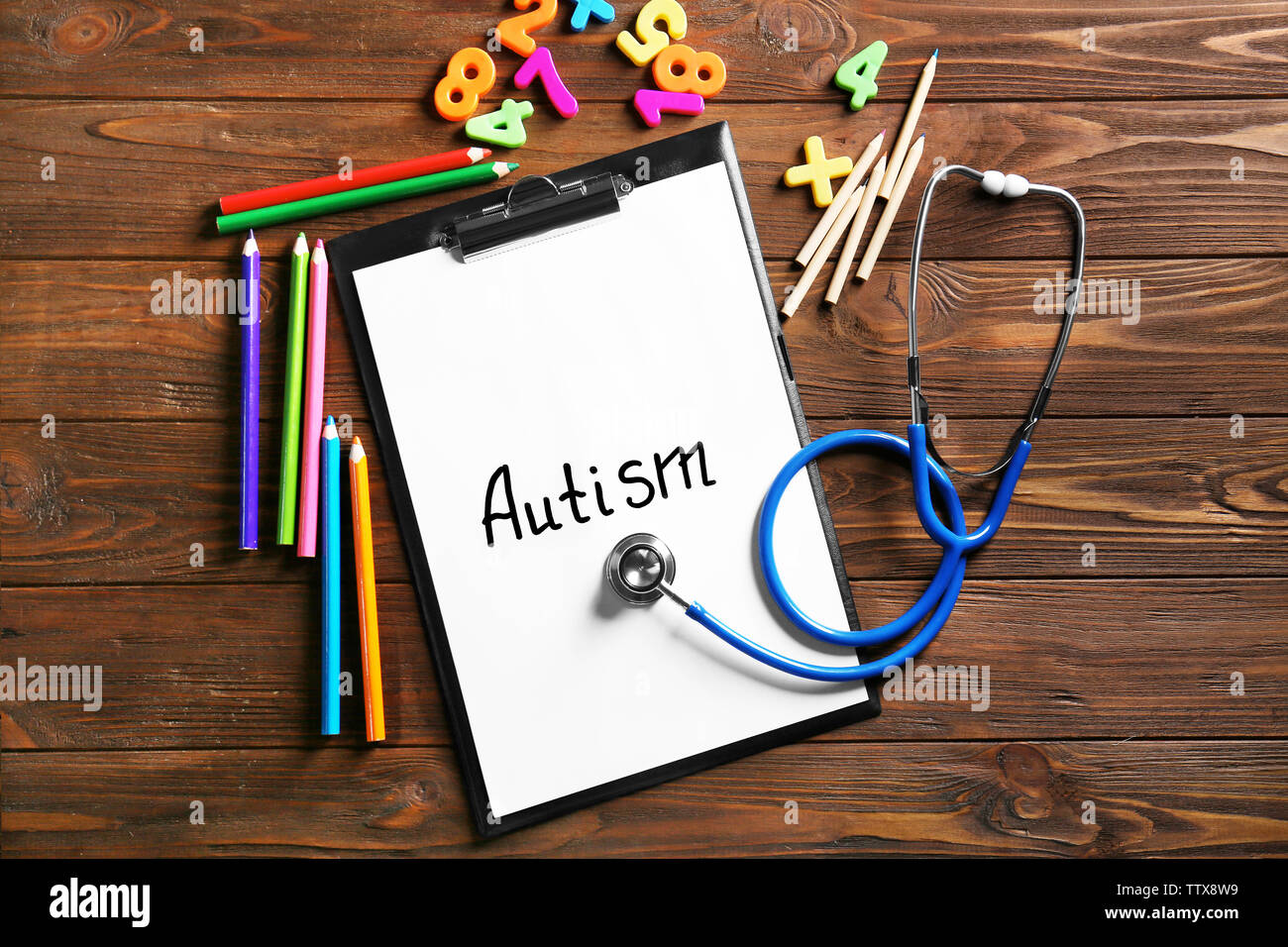 Pediatrician workplace with clipboard and stethoscope. Autism concept ...