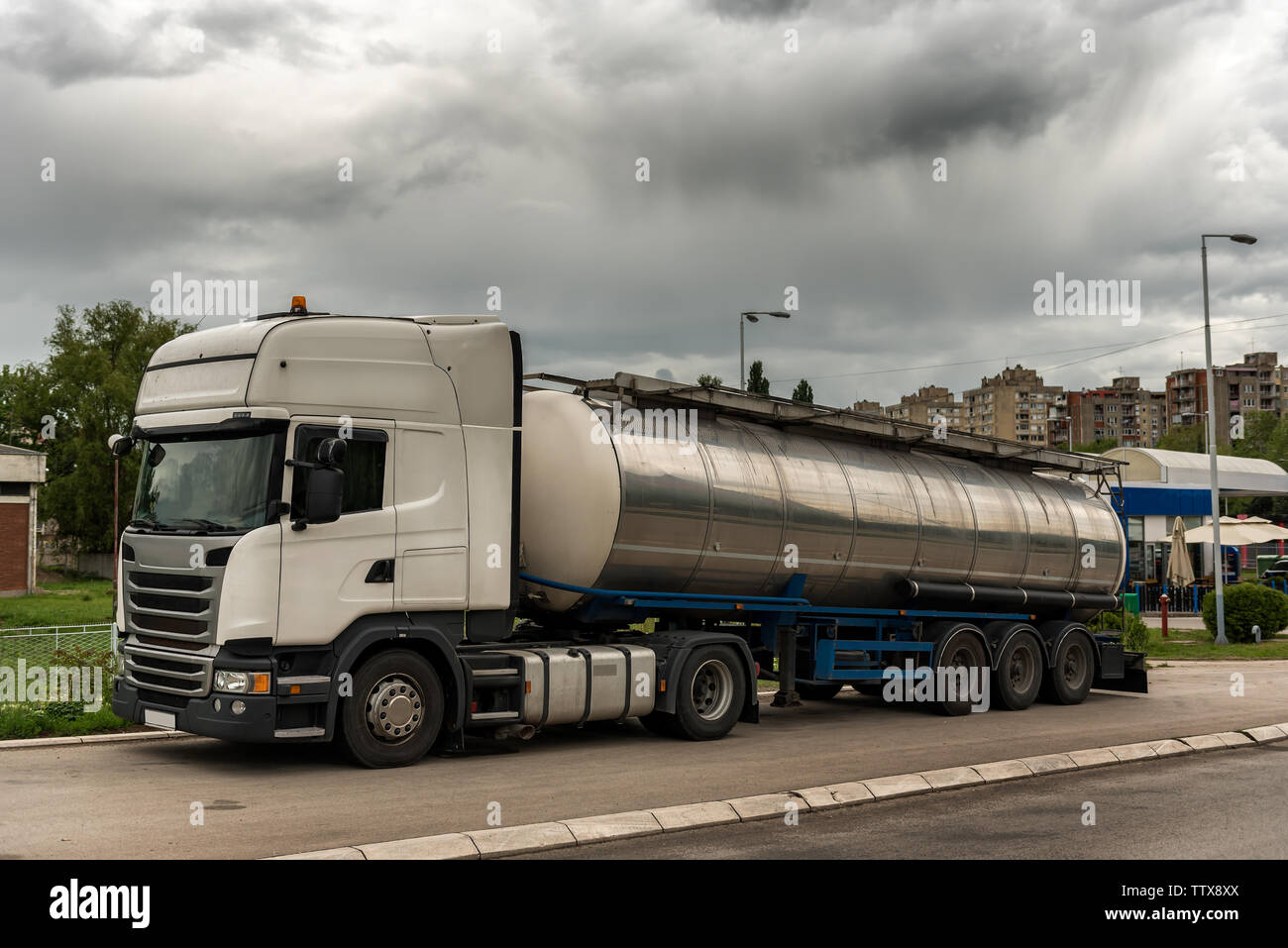 Tank truck parked on by the road in the city, near gas station Stock ...