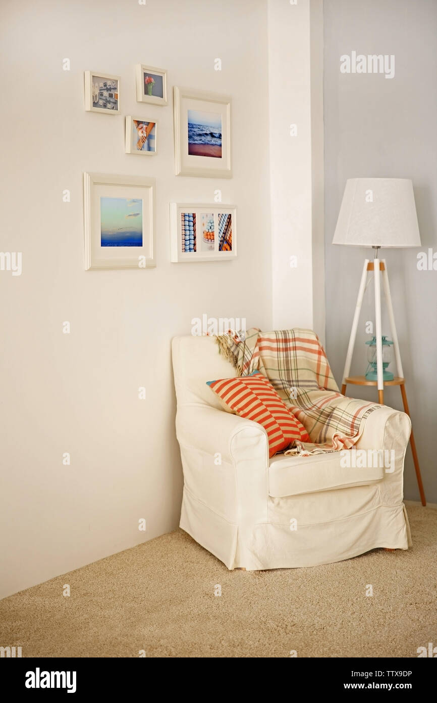 Modern cozy armchair in room interior Stock Photo - Alamy