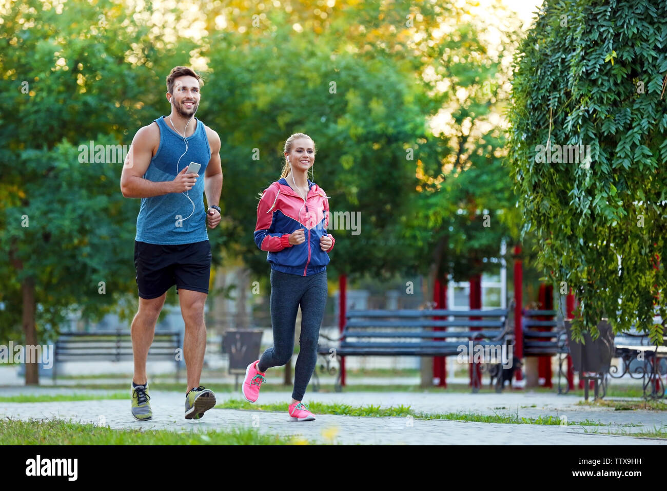 Sportsmen running in park hi-res stock photography and images - Alamy