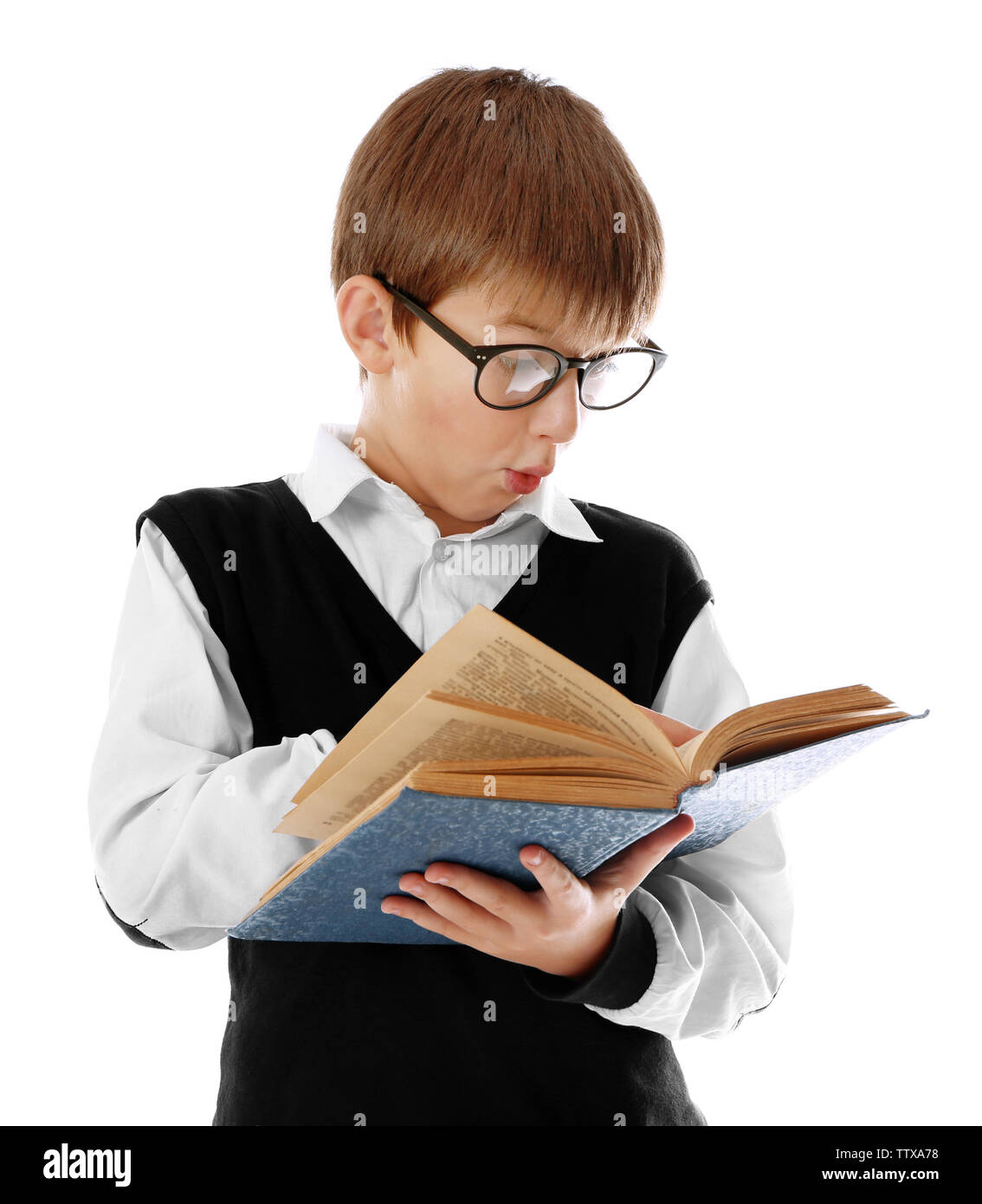 Cute schoolboy reading book on white background Stock Photo - Alamy