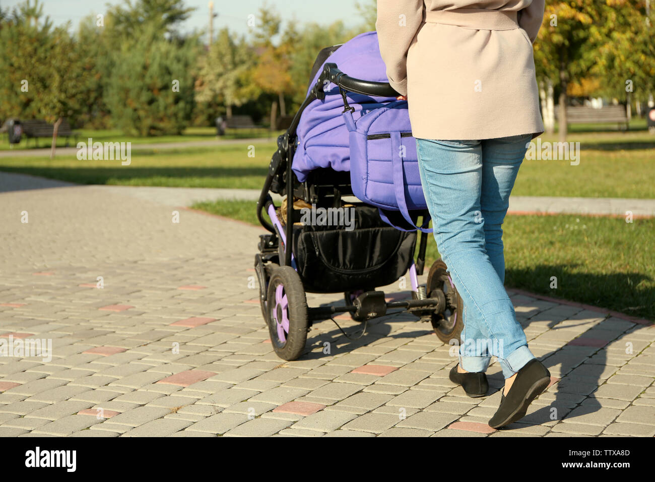 Woman stroller walking back hi-res stock photography and images - Alamy