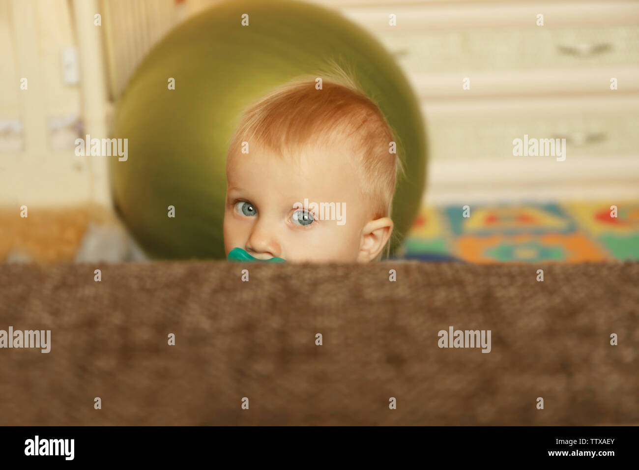 Cute little boy with dummy at home Stock Photo - Alamy