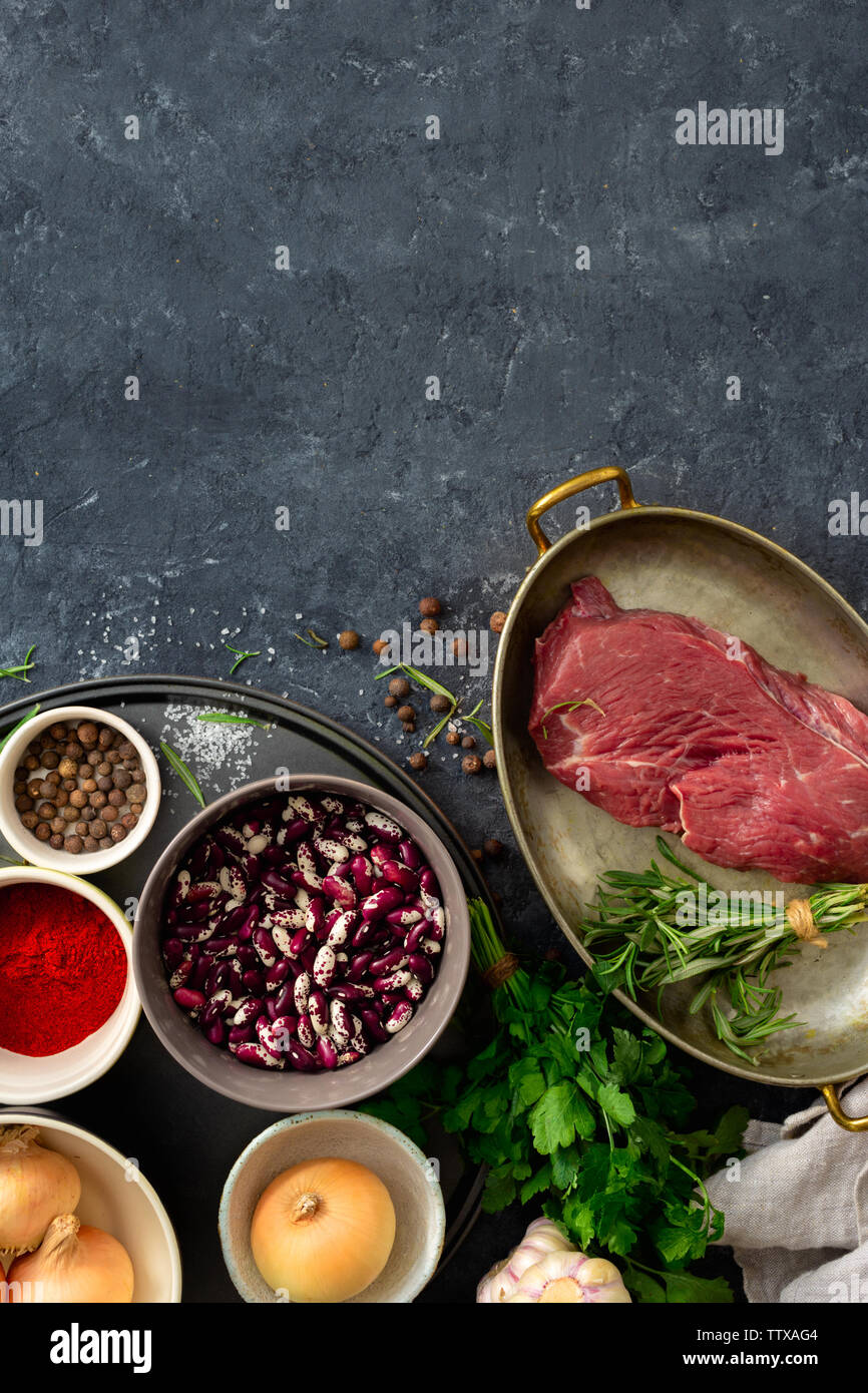 Raw beef meat with ingredients for cooking healthy food. Uncooked beef ...