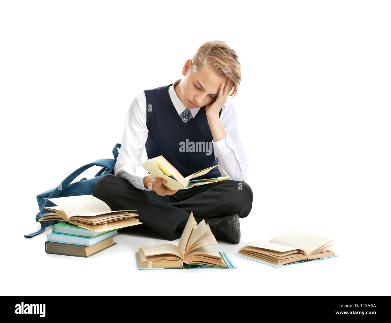 Cute teenager with textbooks on white background Stock Photo - Alamy