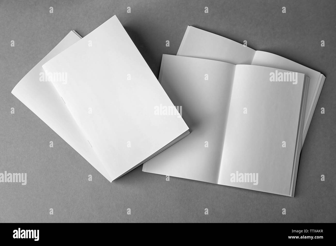 Blank brochures on grey background Stock Photo - Alamy