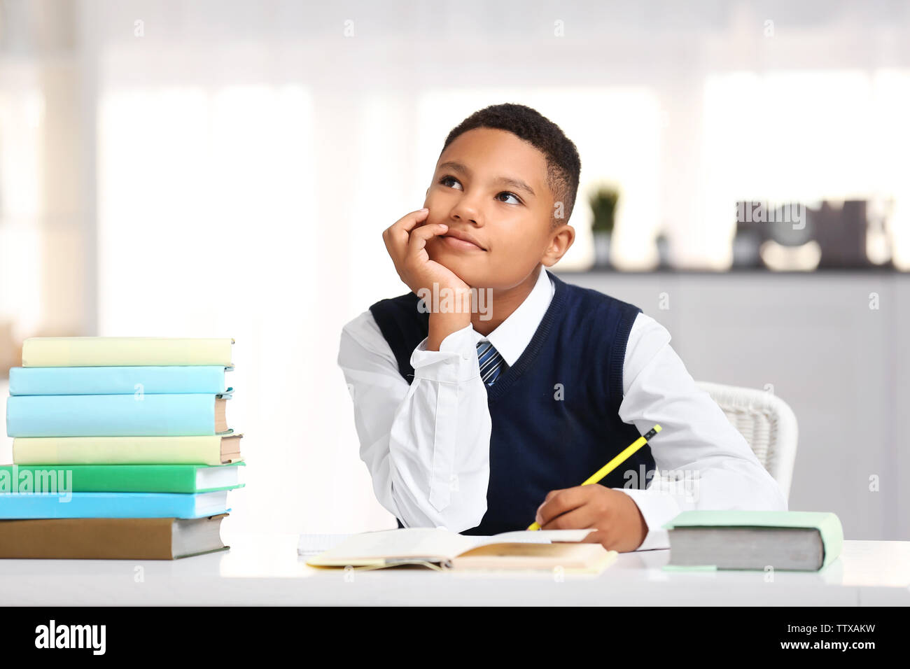 Cute boy at lesson in school Stock Photo - Alamy