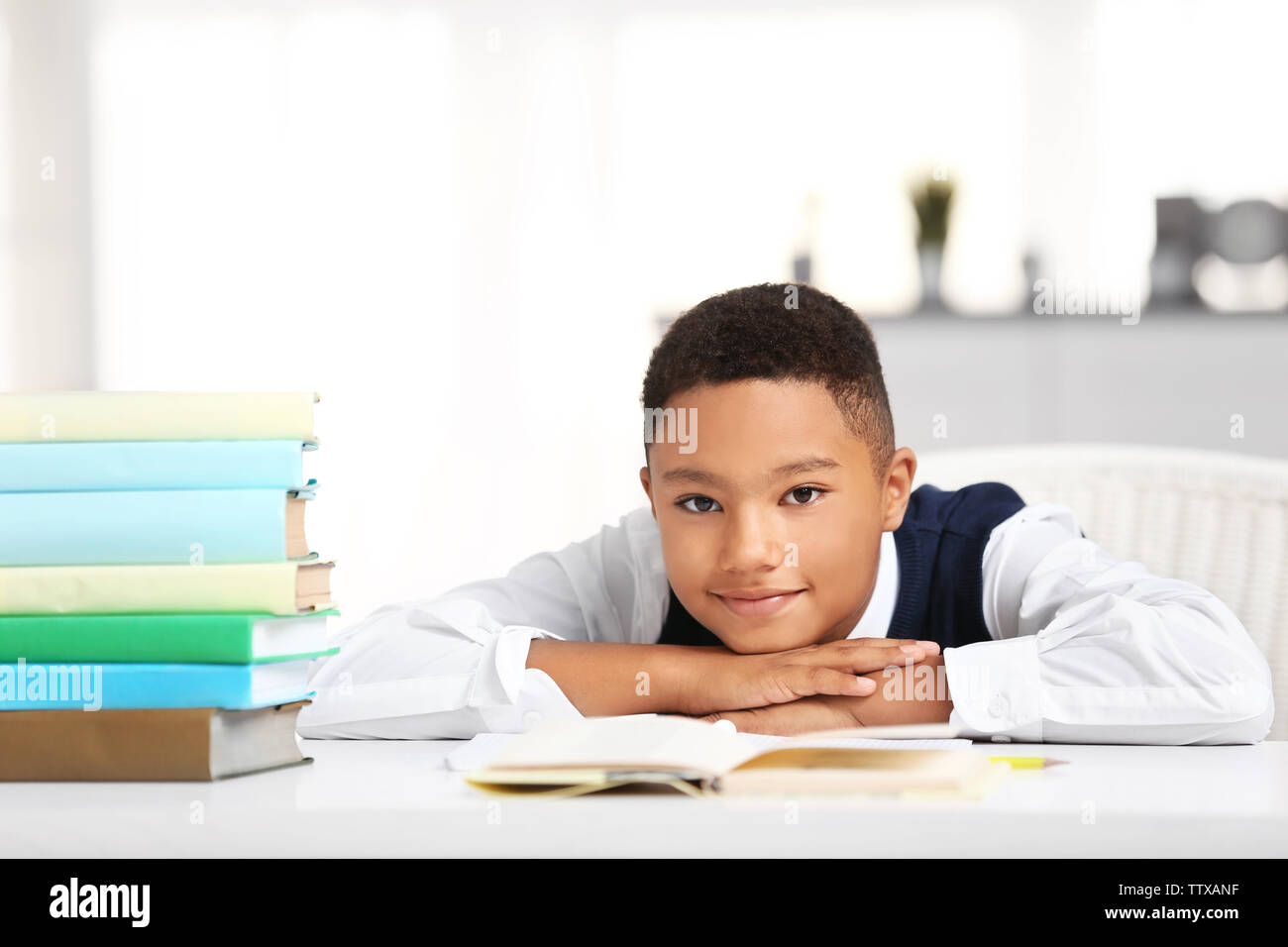 Cute boy at lesson in school Stock Photo - Alamy