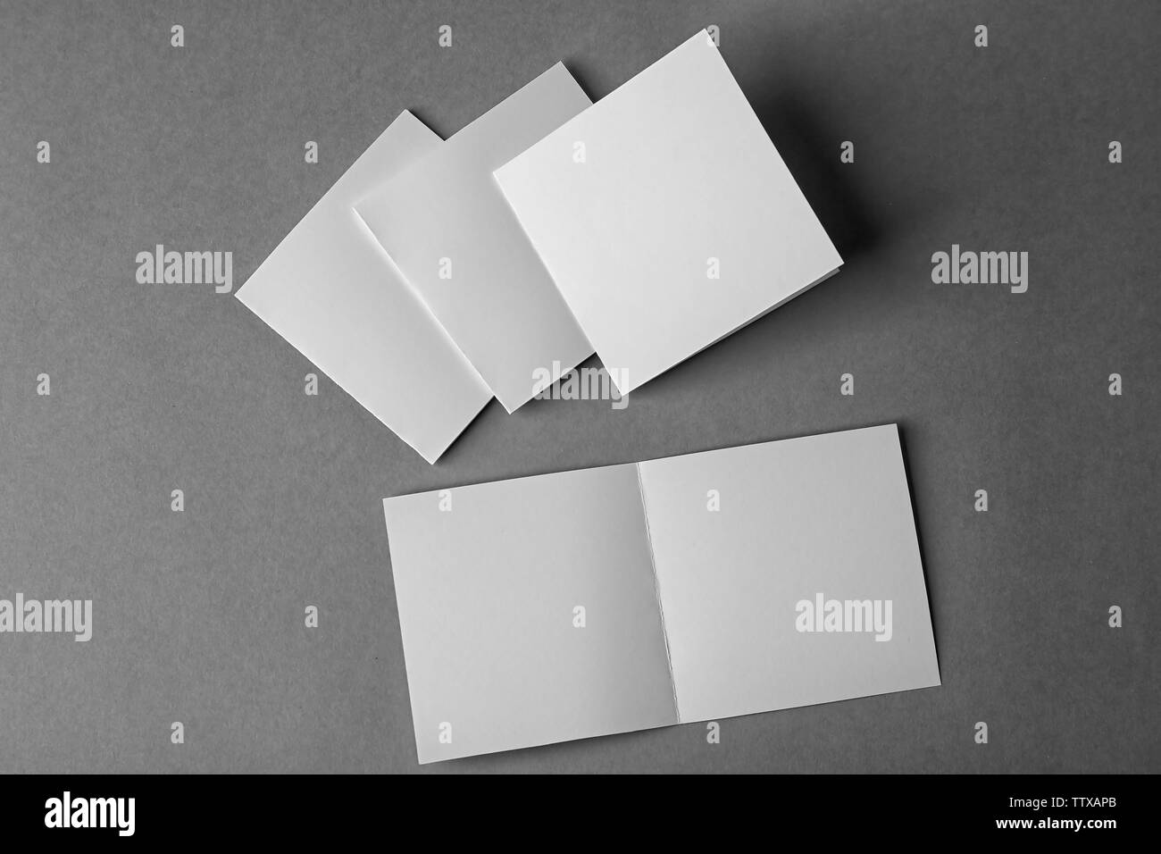 Blank booklets on grey background Stock Photo - Alamy