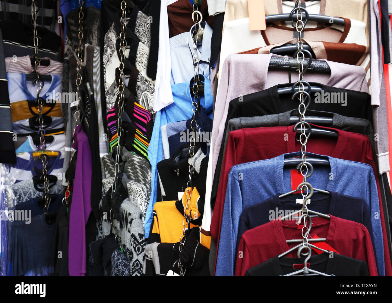 Clothes on rail in clothing store Stock Photo - Alamy