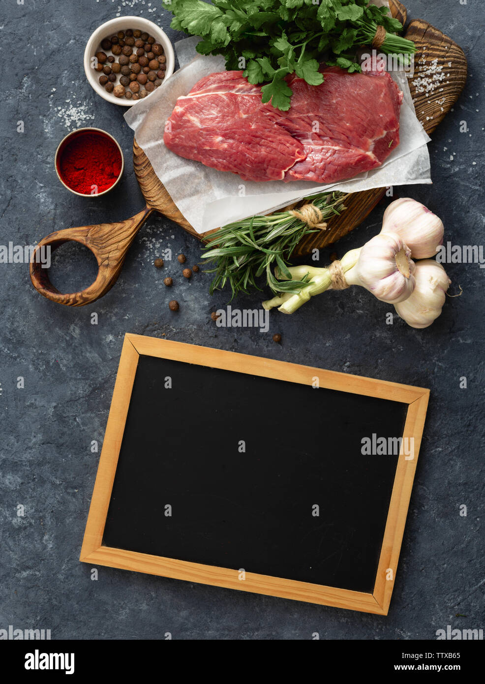 Food menu. Cooking table with blank chalk board and beef meat ...