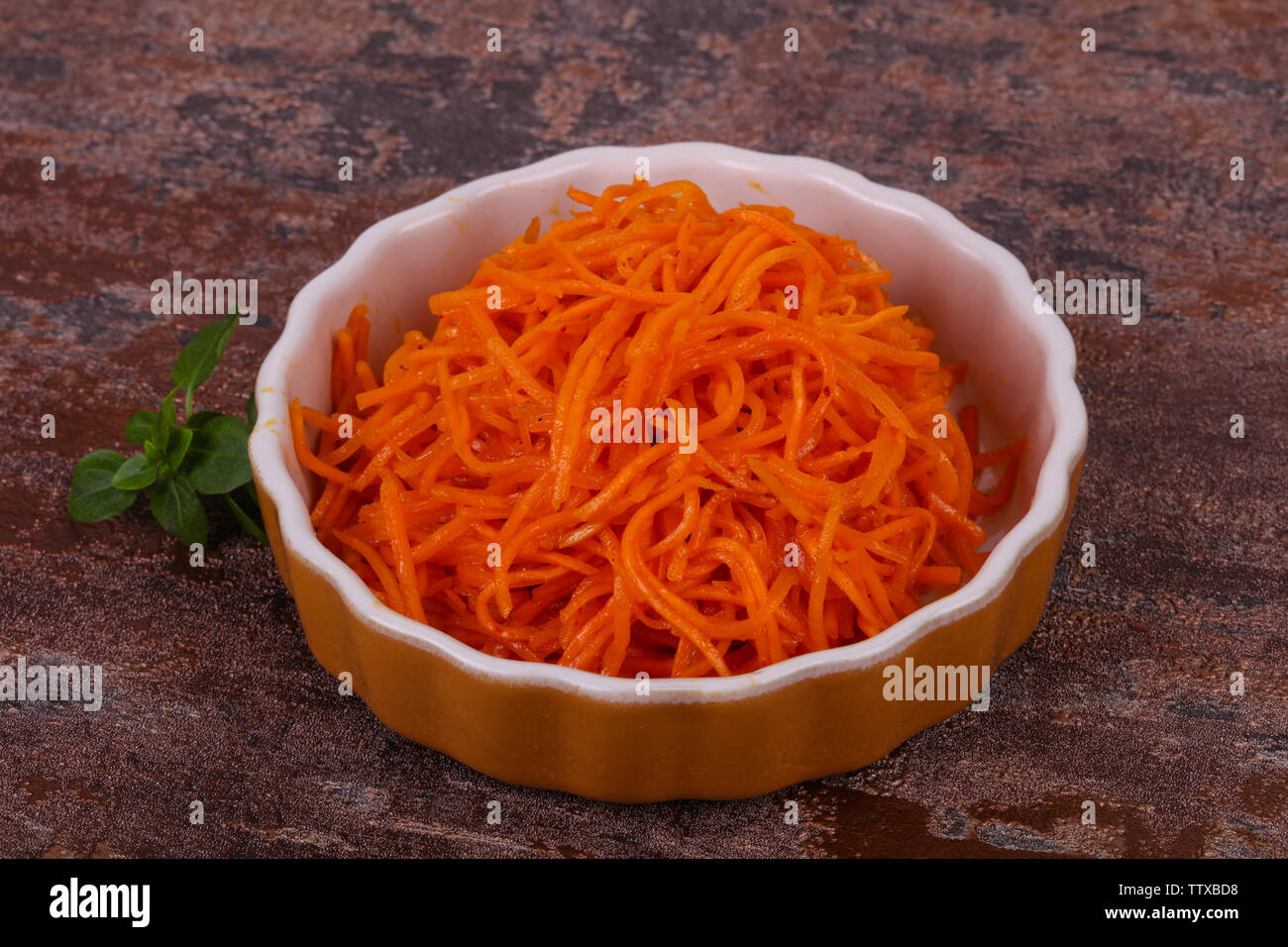 Korean cattot snack salad in the bowl served basil leaves Stock Photo ...