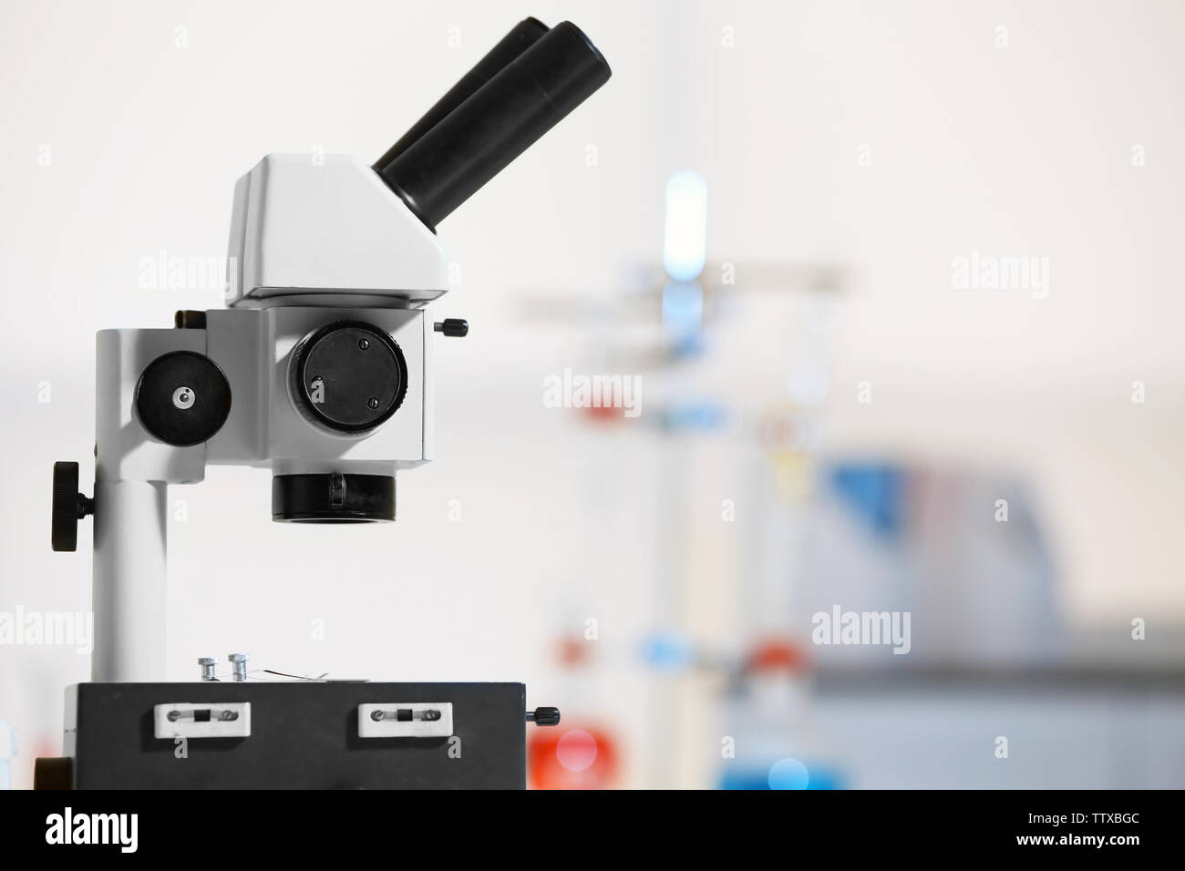 Modern microscope in office Stock Photo - Alamy