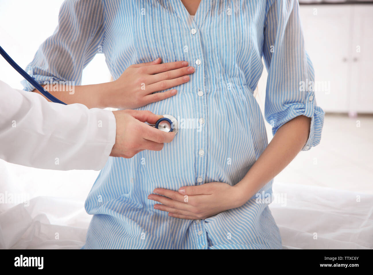Gynecology consultation. Pregnant woman with her doctor in clinic Stock ...