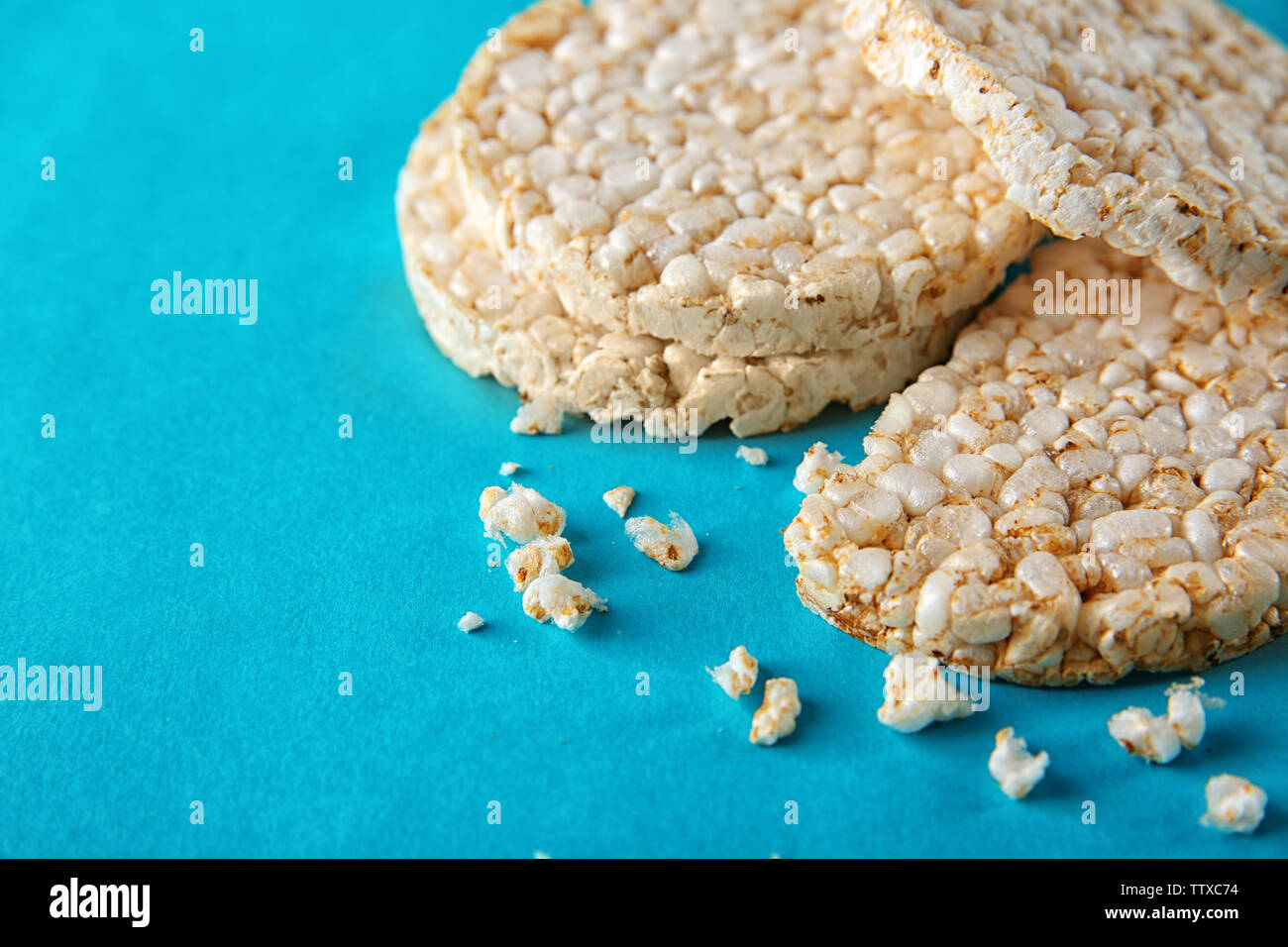 Rice crackers on blue background Stock Photo - Alamy