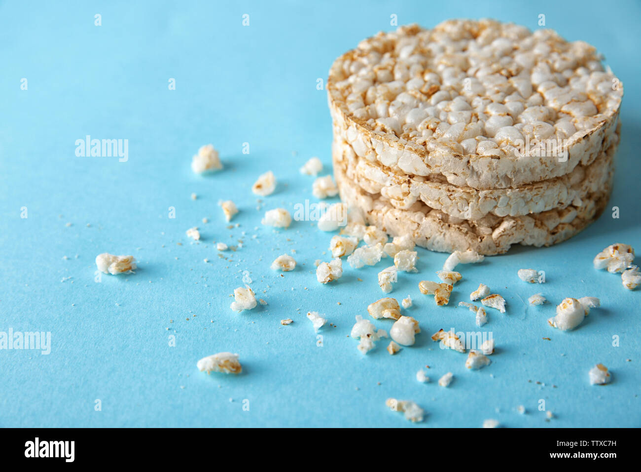 Rice crackers on blue background Stock Photo - Alamy