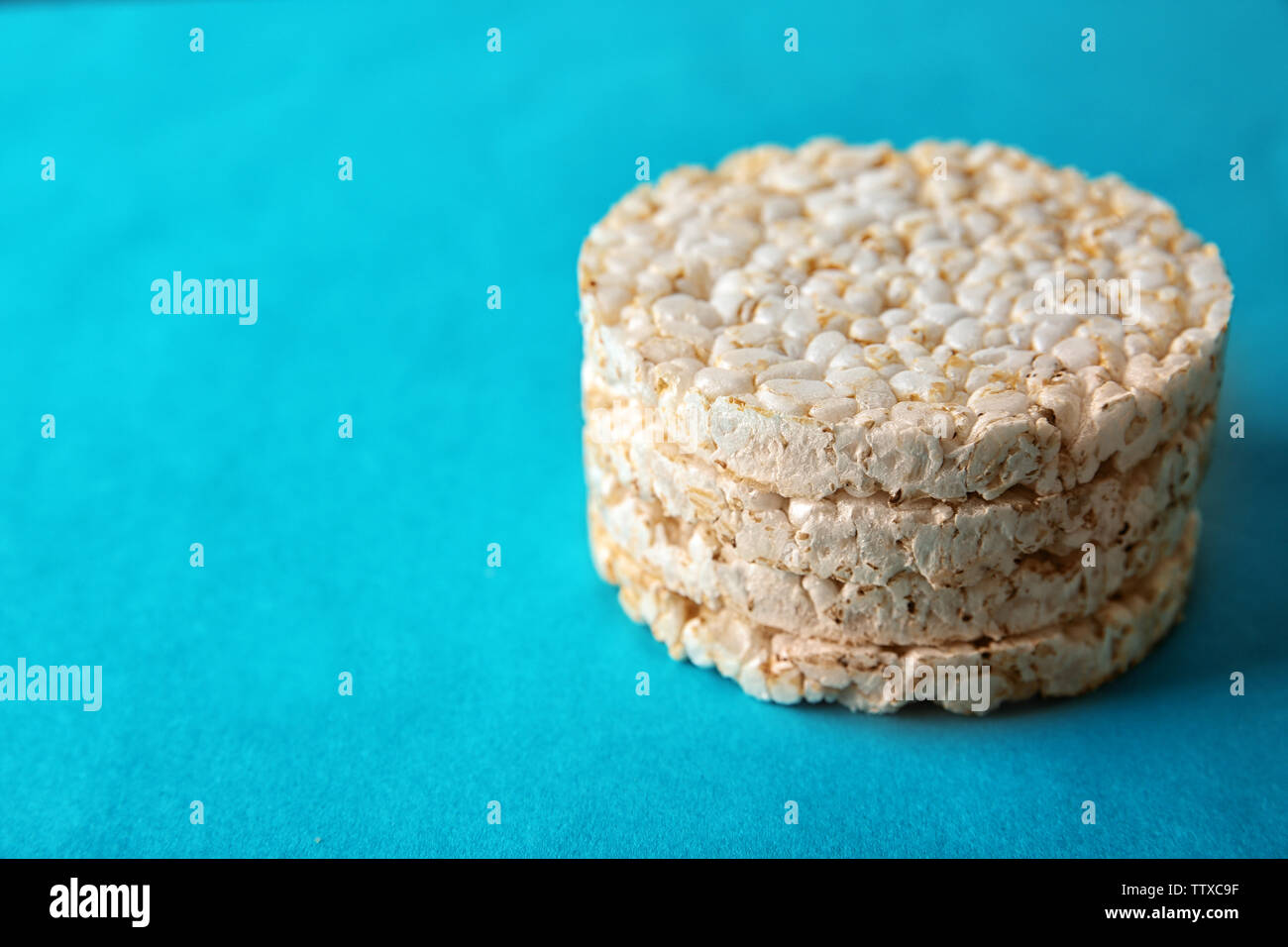 Rice crackers on blue background Stock Photo - Alamy