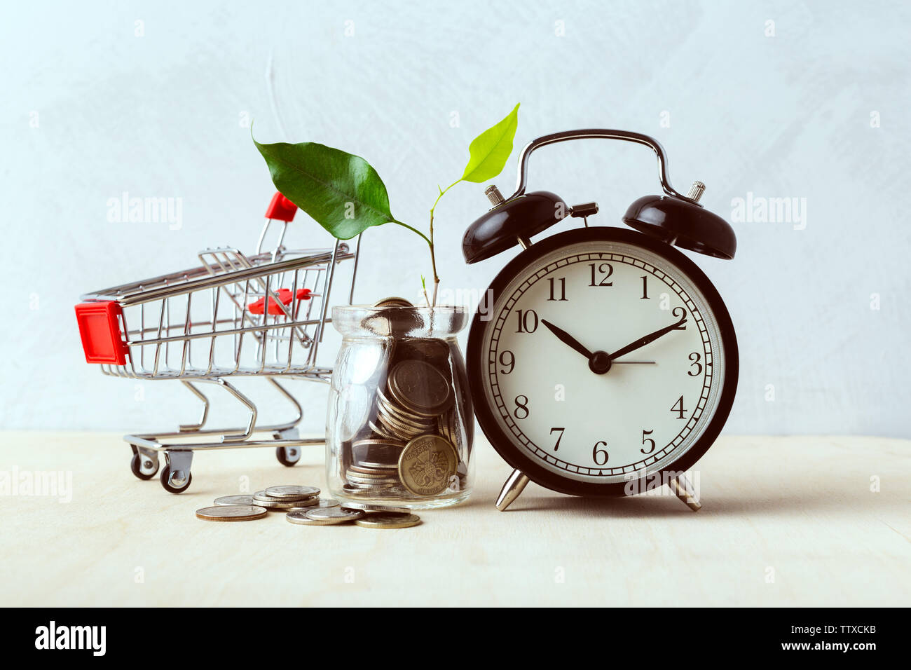 Saving Money Concept. Shopping trolley or cart with coin Stock Photo ...