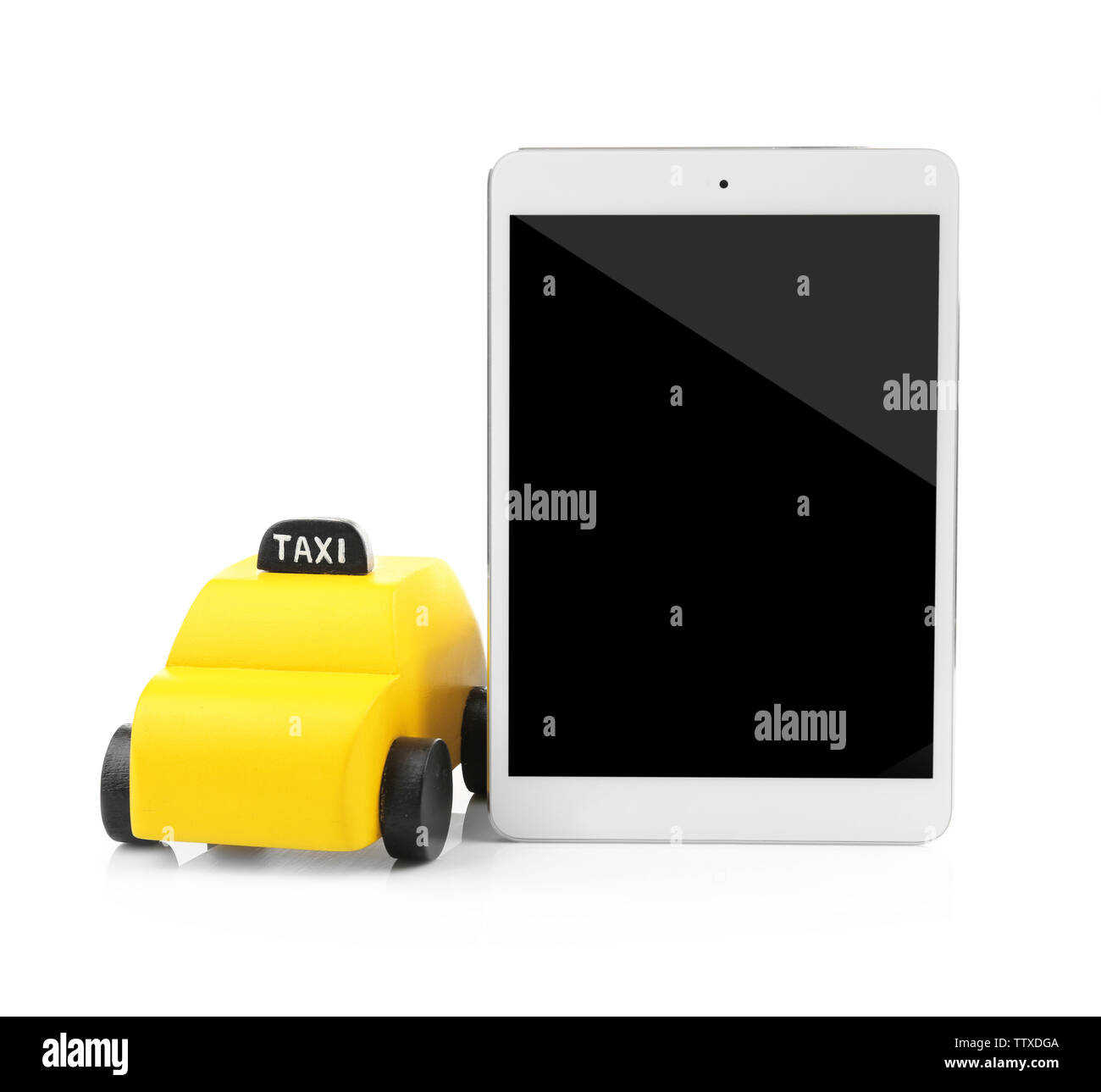 Yellow toy taxi cab and tablet isolated on white Stock Photo - Alamy
