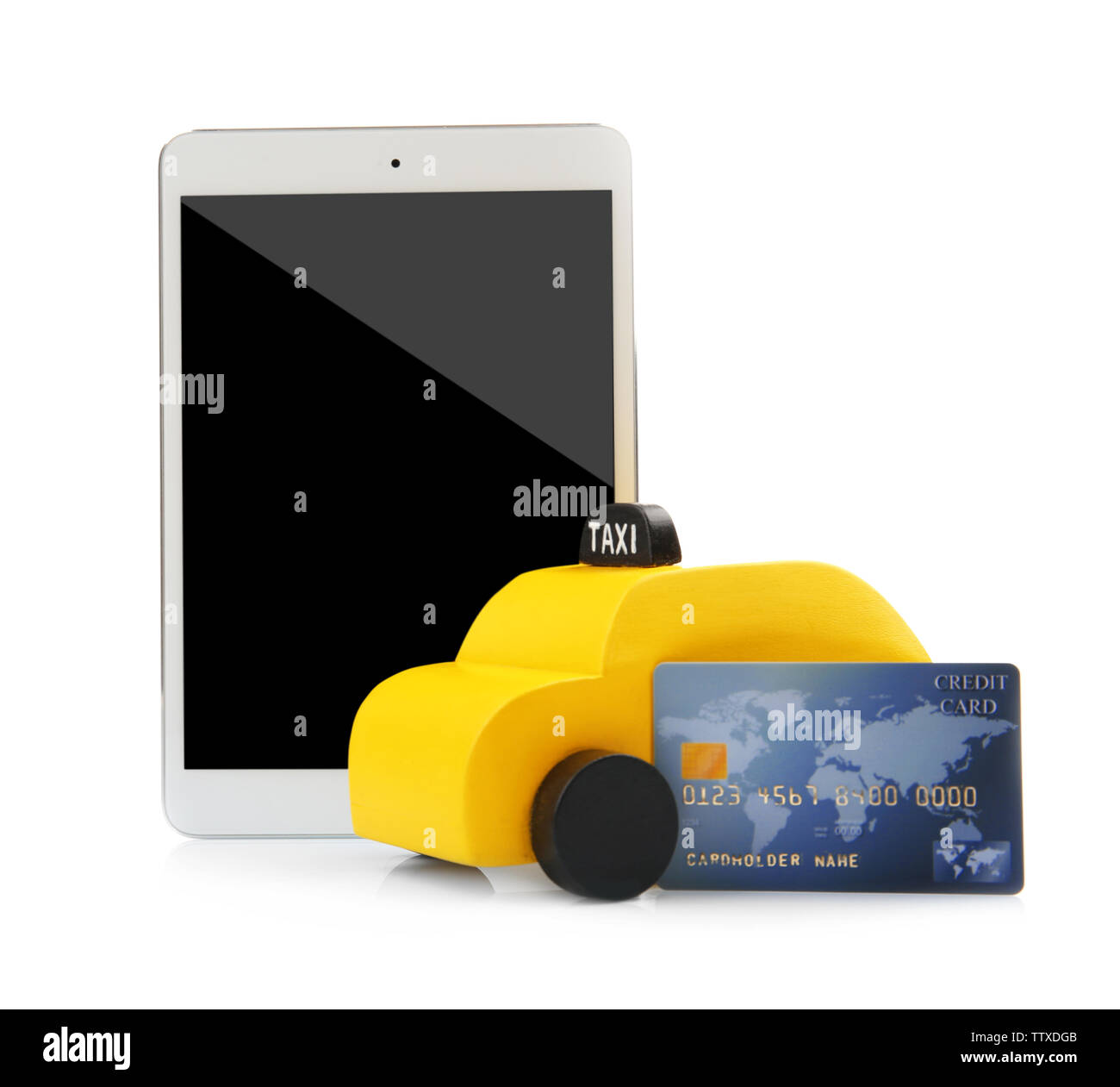Yellow toy taxi cab, tablet and credit card isolated on white Stock ...