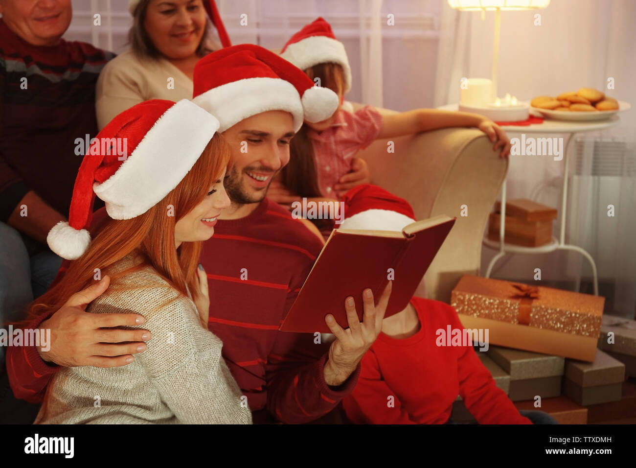 Father christmas reading book hi-res stock photography and images - Alamy