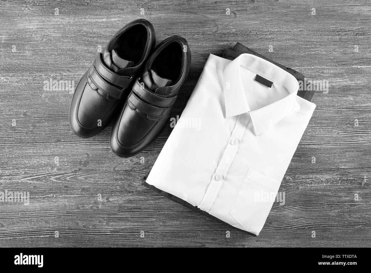 School uniform clothing Black and White Stock Photos & Images - Alamy