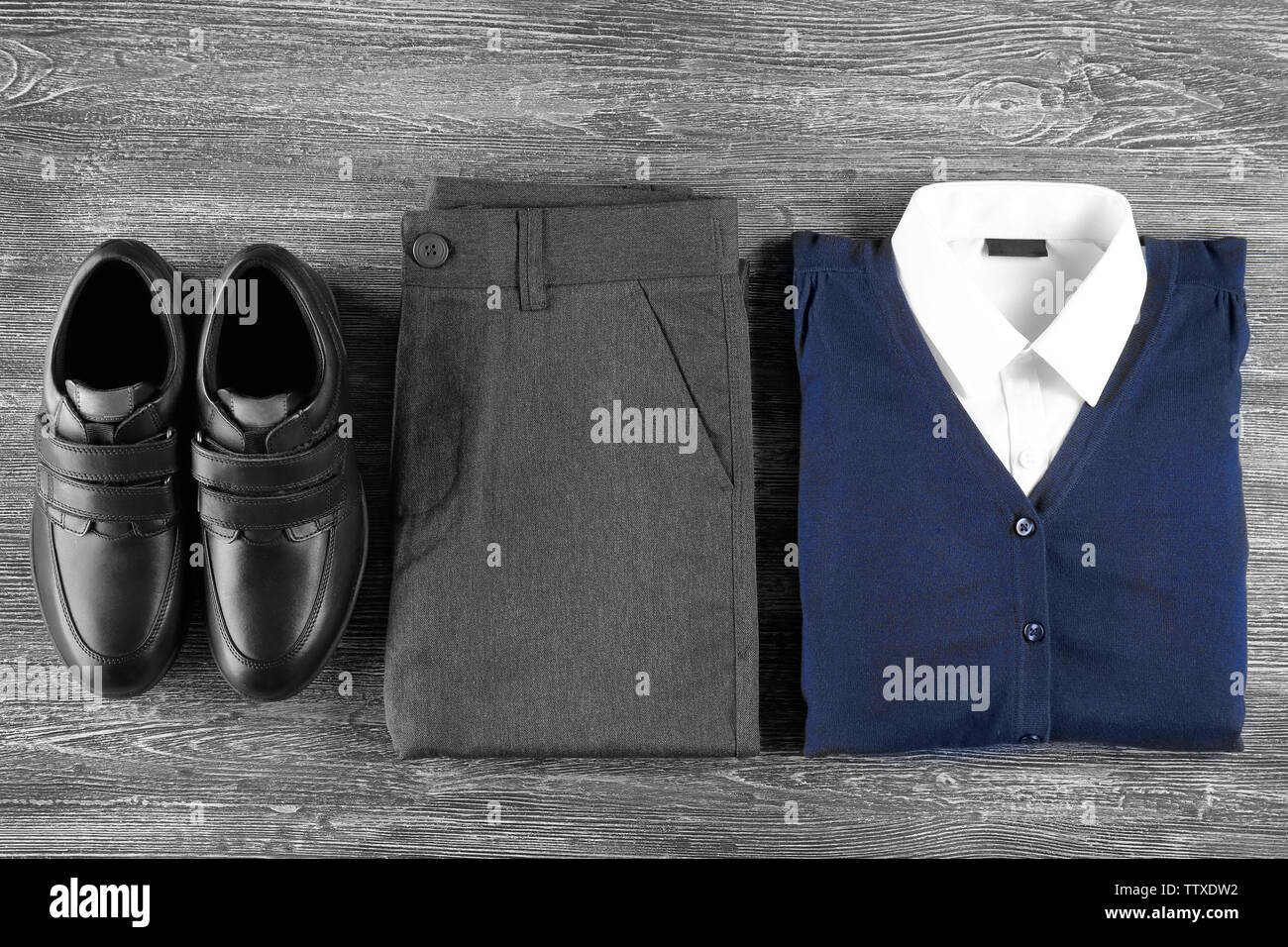 School uniform on wooden hi-res stock photography and images - Alamy