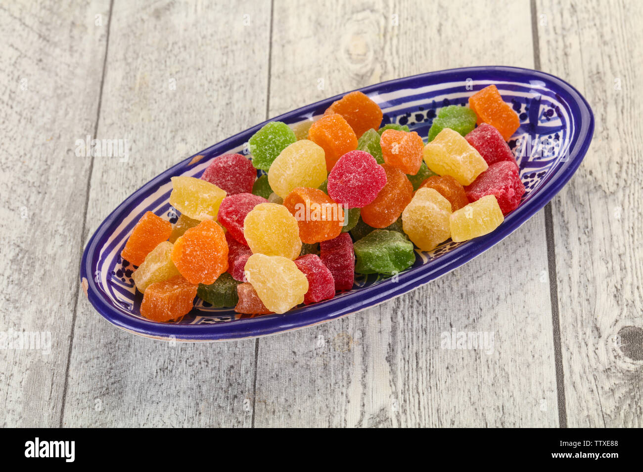 Sweet candied fruit heap in the bowl Stock Photo - Alamy