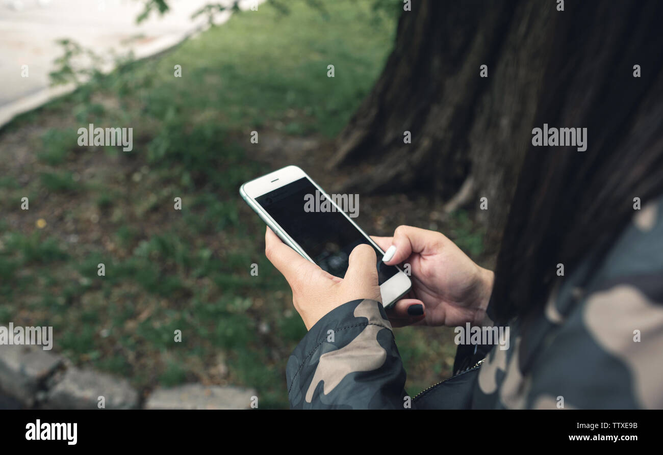 Female hands holding smartphone texting hi-res stock photography and ...