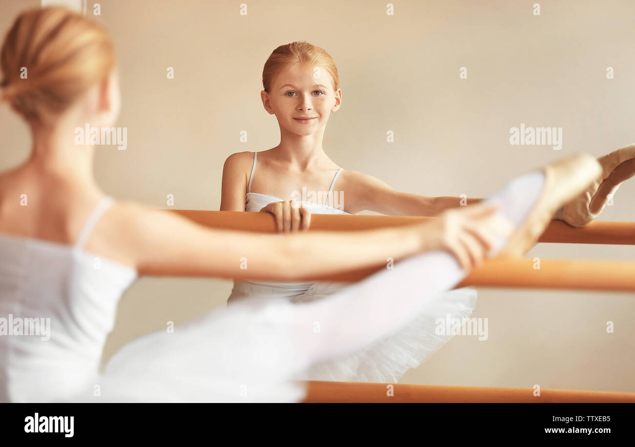 Young beautiful ballerina posing in dance studio Stock Photo - Alamy