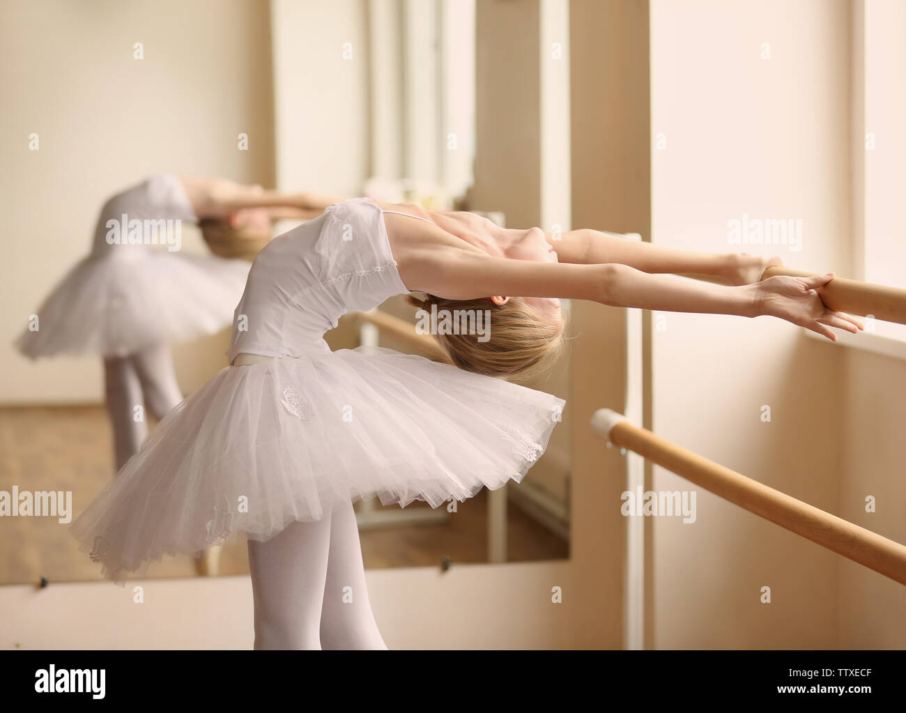 Young beautiful ballerina posing in dance studio Stock Photo - Alamy