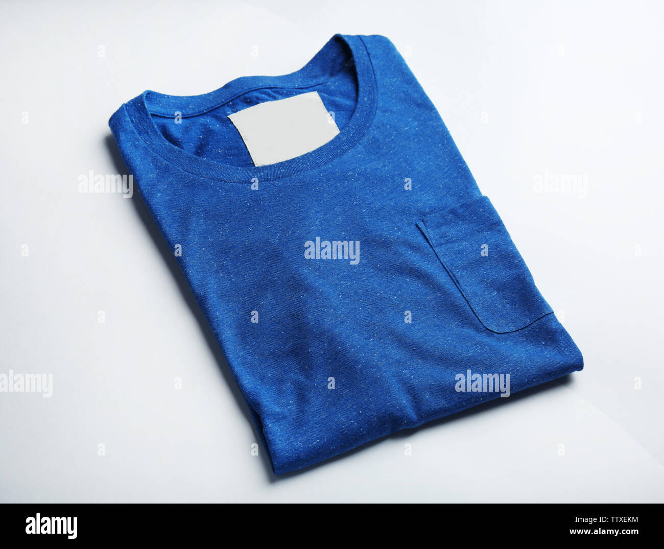 Blank blue t-shirt on white background Stock Photo - Alamy