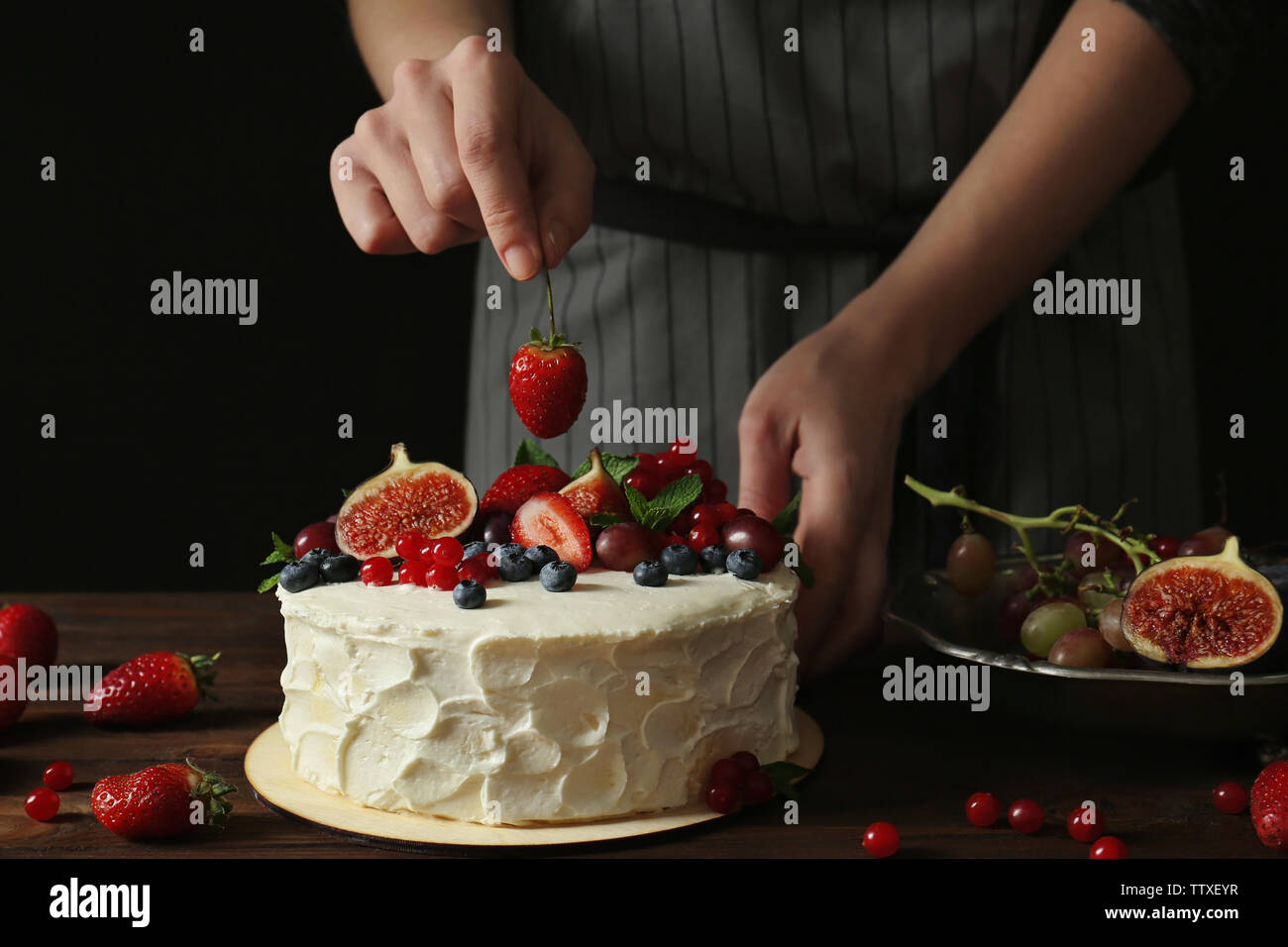 Baker hand decorating creamy hi-res stock photography and images - Alamy