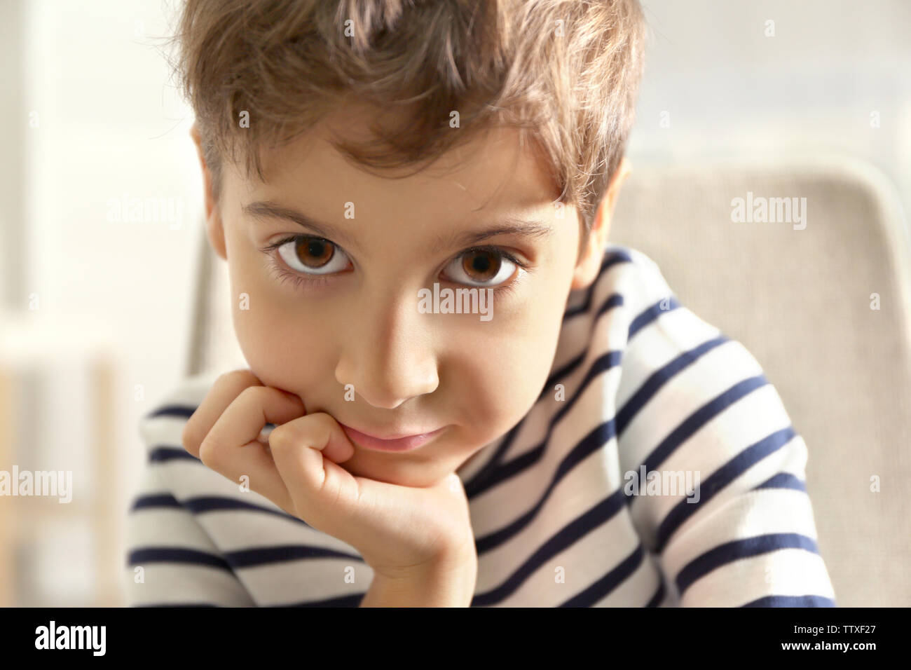 Portrait of cute positive boy indoors Stock Photo - Alamy
