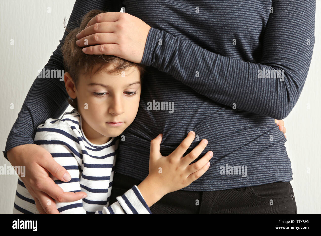 Son hug mother sad hi-res stock photography and images - Alamy