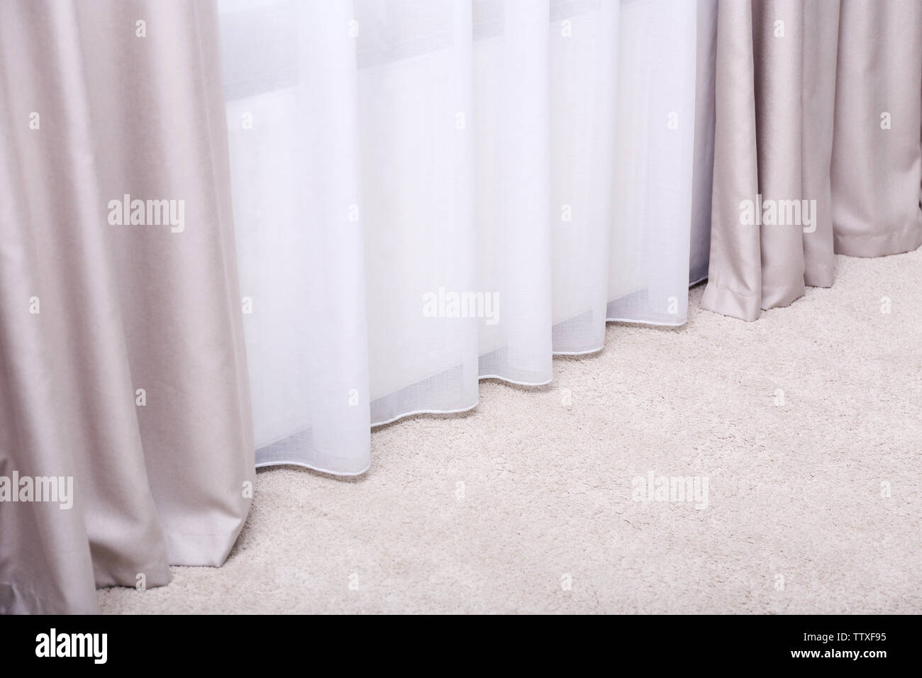 Window with new elegant curtain Stock Photo - Alamy