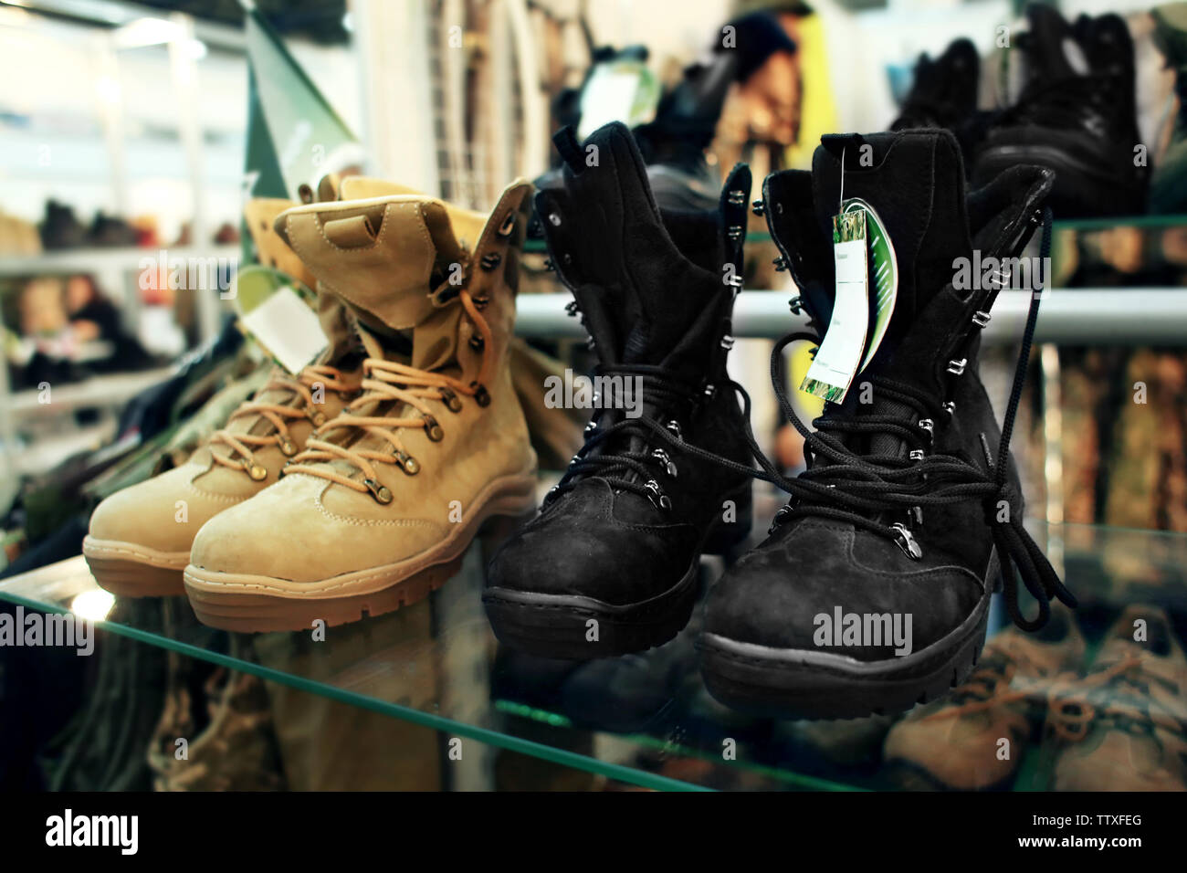 Special army boots on glass shelf at exhibition Stock Photo - Alamy