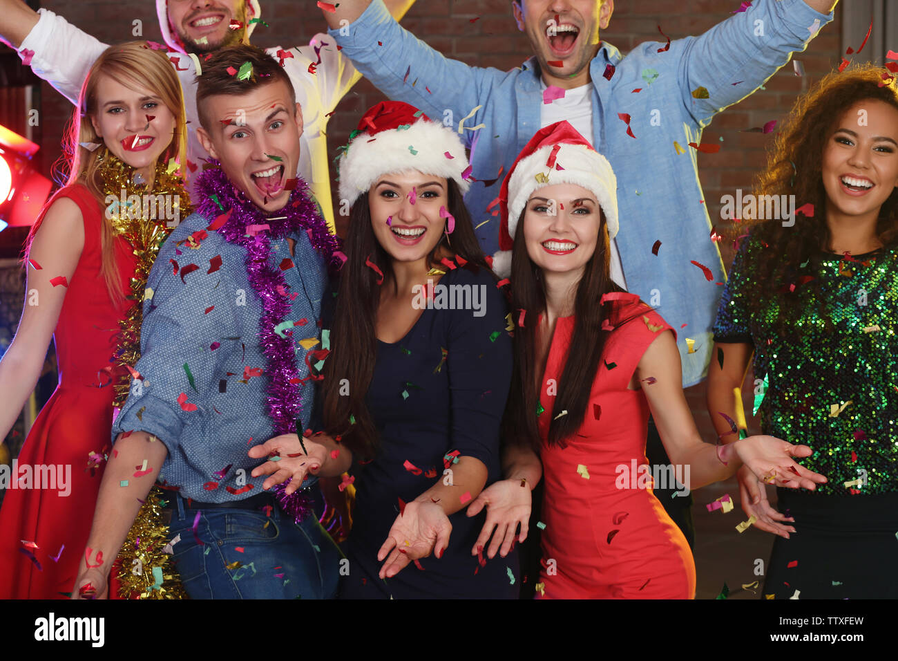 Young people having fun at Christmas party Stock Photo - Alamy