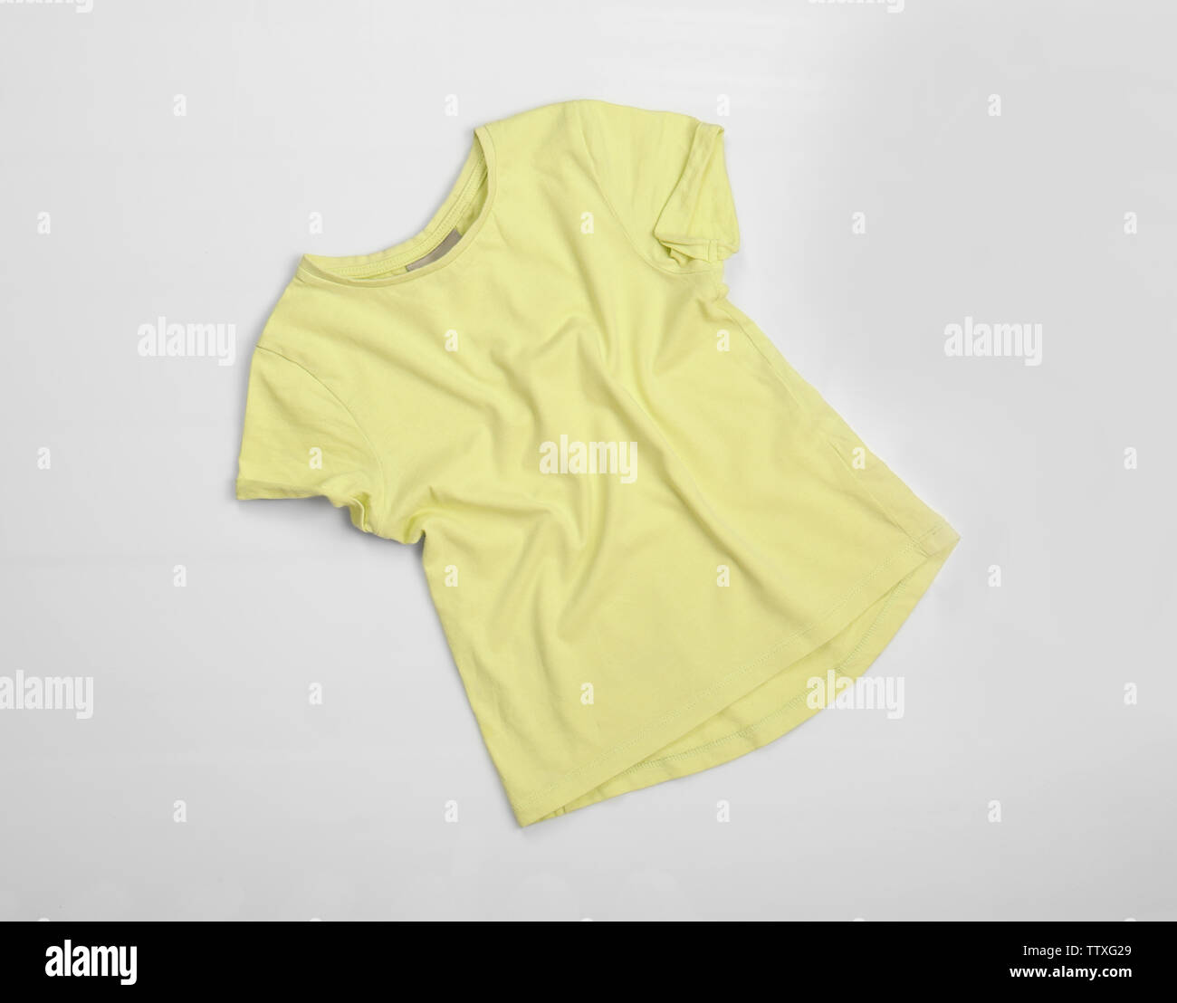 Blank color t-shirt on white background Stock Photo - Alamy