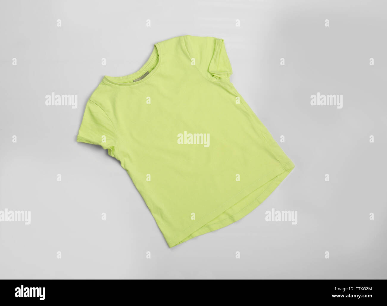 Blank color t-shirt on white background Stock Photo - Alamy