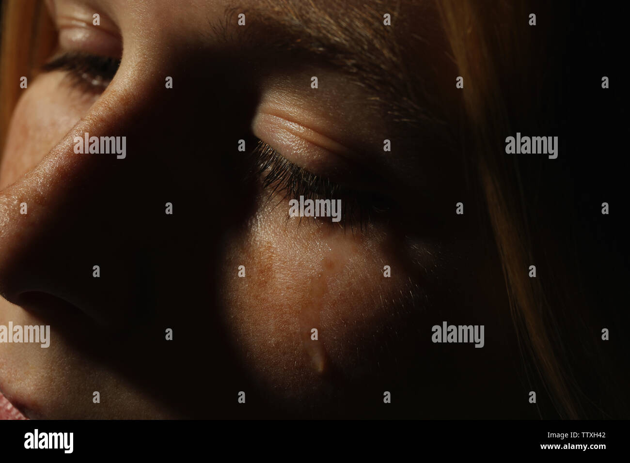 Closeup of crying girl face Stock Photo - Alamy