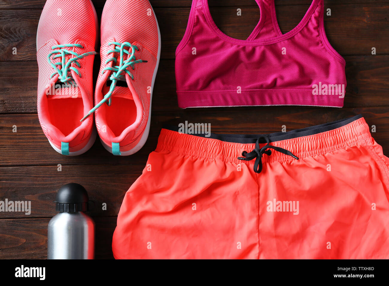 Clothes and items for sport on table Stock Photo - Alamy
