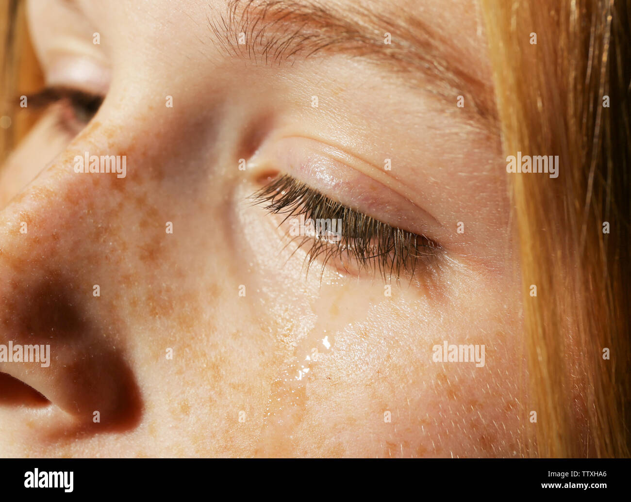 Closeup of crying girl face Stock Photo - Alamy