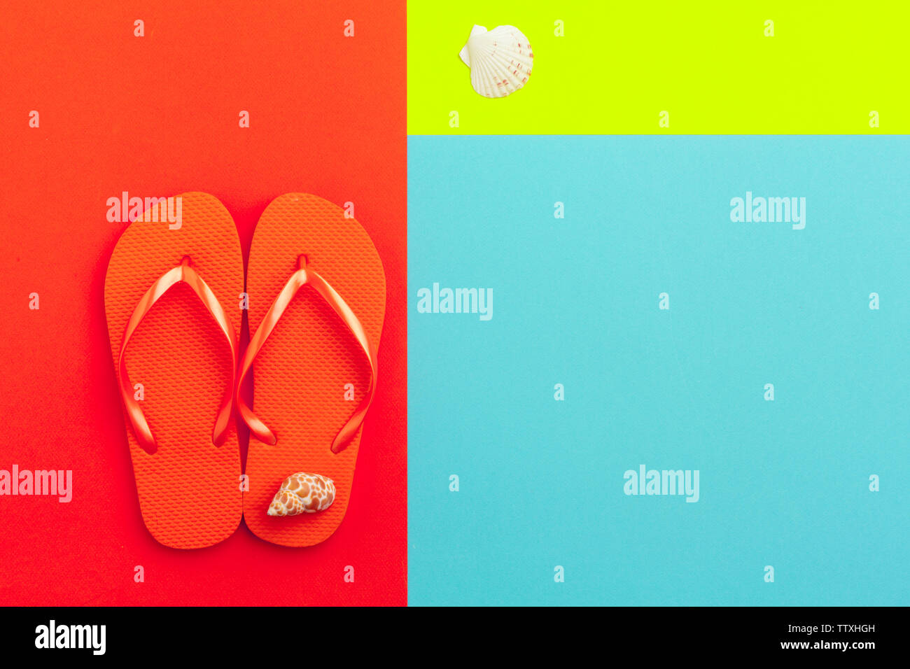 Female flip flops on a color block background Stock Photo - Alamy